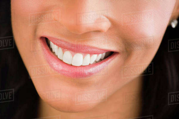 Close-up of woman smiling - Royalty-free Stock Photo | Dissolve