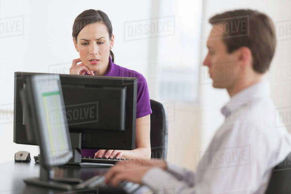 Office workers using computers - Royalty-free Stock Photo | Dissolve