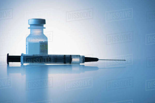 Close up of syringe and medication, studio shot - Royalty-free Stock ...