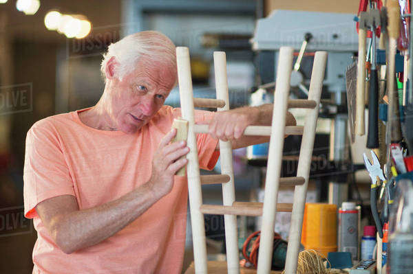 Man making stool - Royalty-free Stock Photo | Dissolve