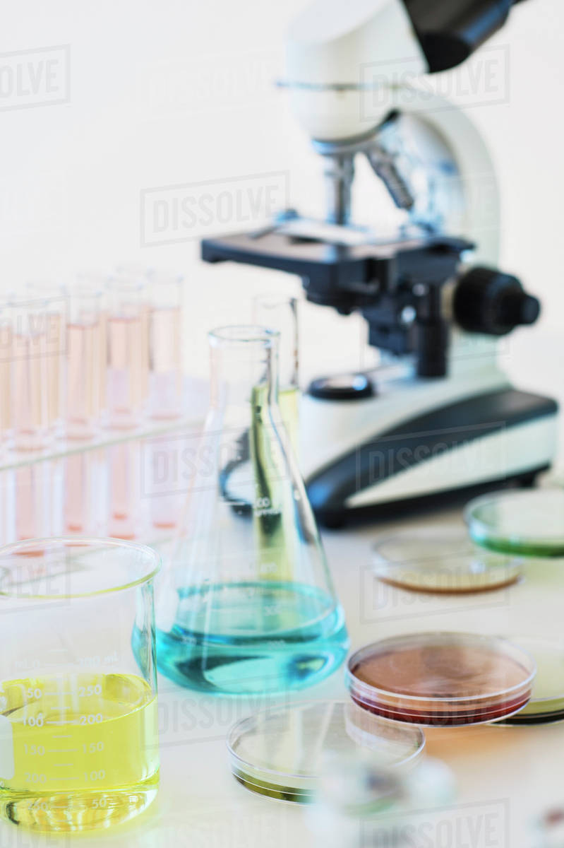 Beakers and microscope - Royalty-free Stock Photo | Dissolve