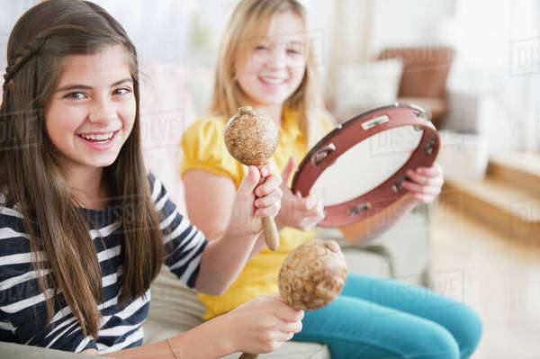 Two girls playing music on instruments - Royalty-free Stock Photo ...