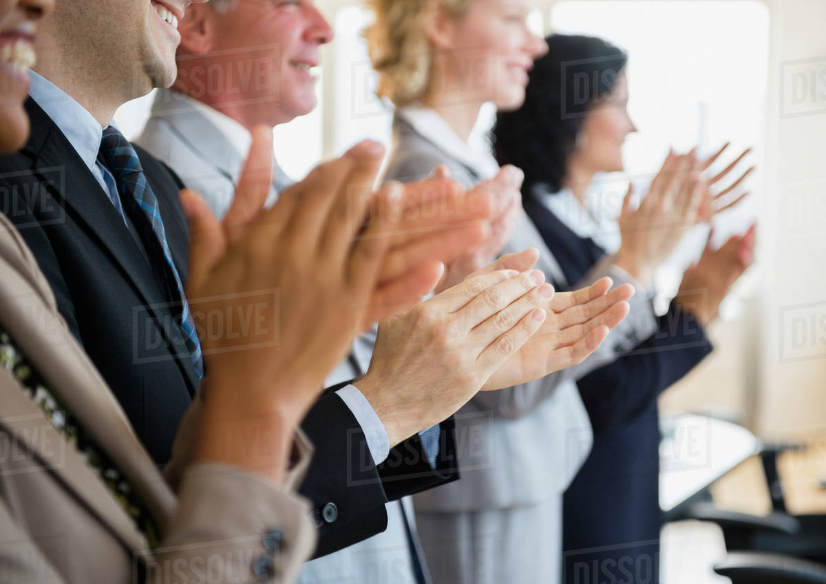 Office workers applauding - Stock Photo - Dissolve