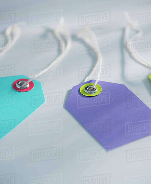 Close up of gift tags with strings - Royalty-free Stock Photo | Dissolve