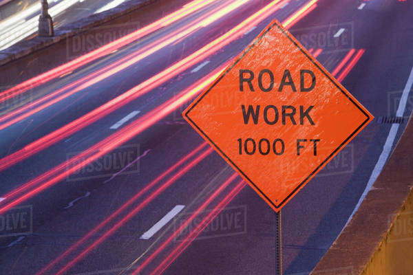 USA, New York state, New York city, road sign with vehicle lights ...