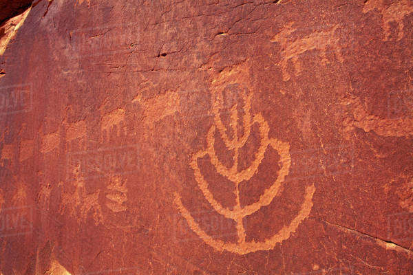 USA, Utah, Native American art on stone wall - Stock Photo - Dissolve