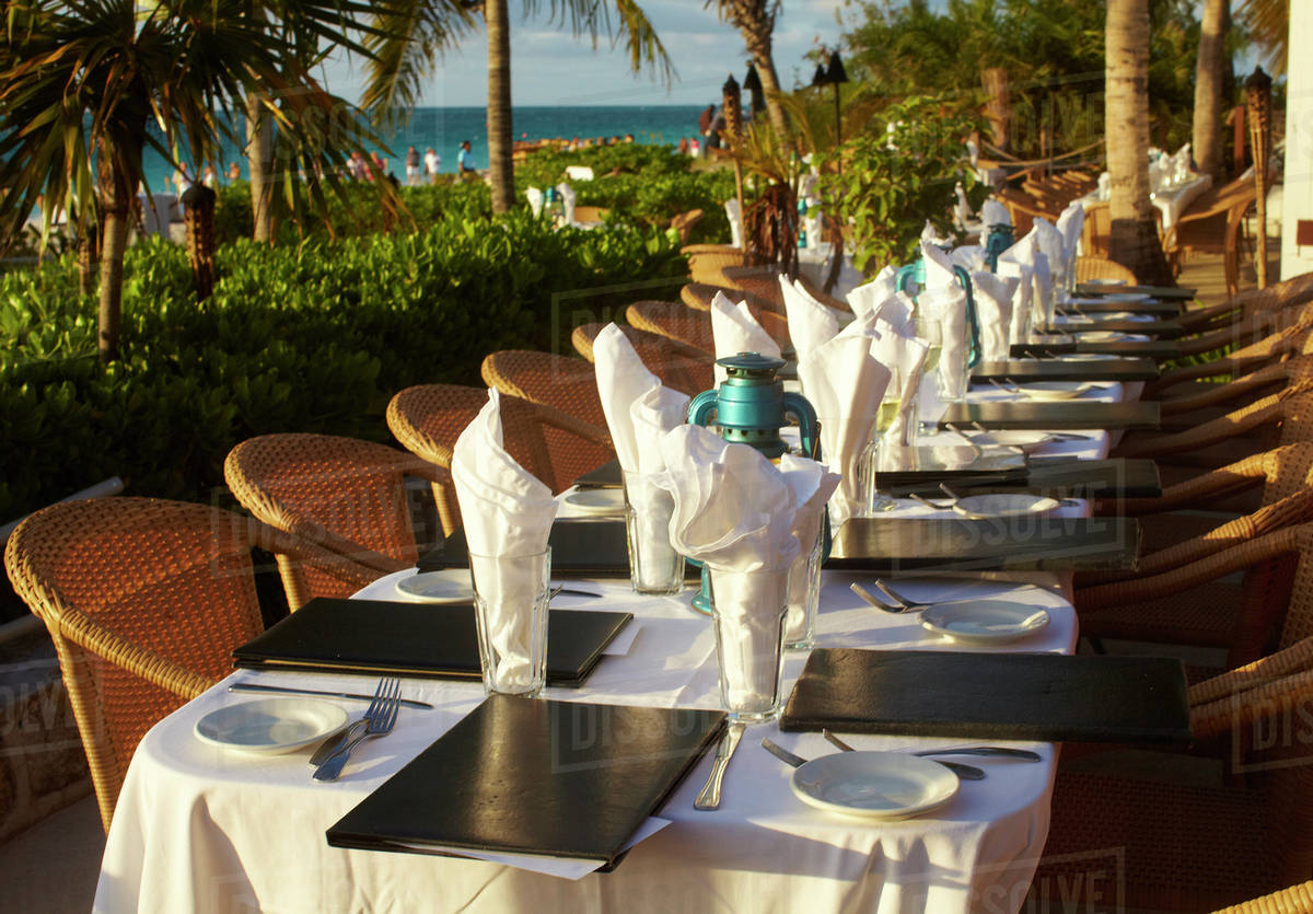 Beach resort outdoor restaurant table settings - Royalty-free Stock ...