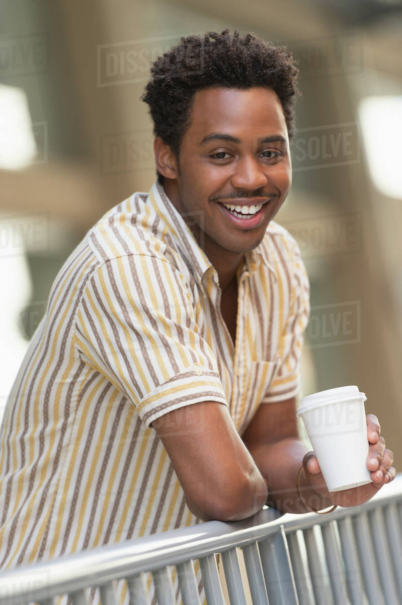 Man drinking coffee outdoors - Royalty-free Stock Photo | Dissolve