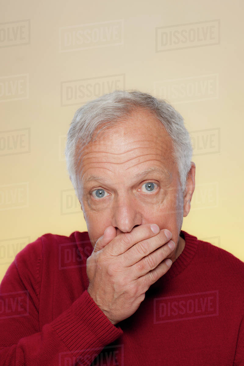 Studio shot of senior man covering lips - Royalty-free Stock Photo ...