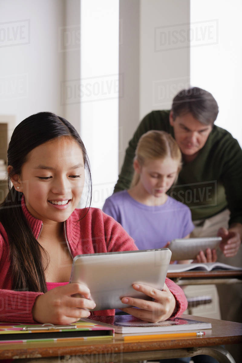 Teacher and teenage students (14-15) - Royalty-free Stock Photo | Dissolve