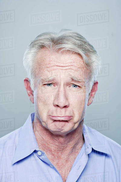 Portrait of senior man making sad face, studio shot - Royalty-free ...