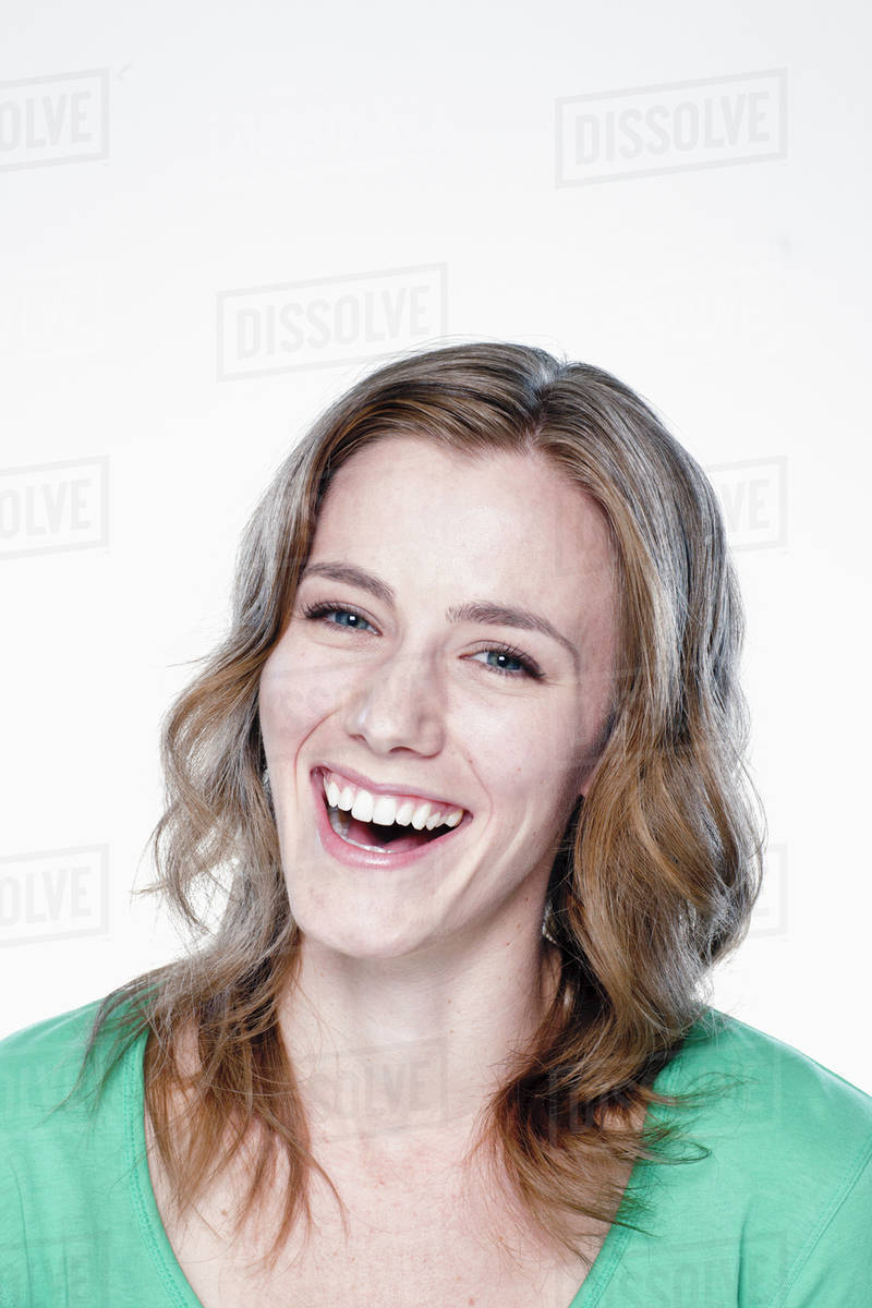 Portrait of laughing young woman, studio shot - Royalty-free Stock ...