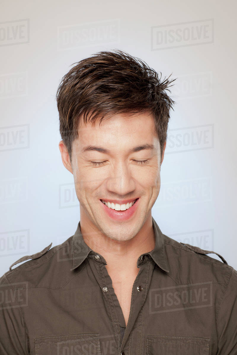 Portrait of man smiling with eyes closed - Royalty-free Stock Photo ...