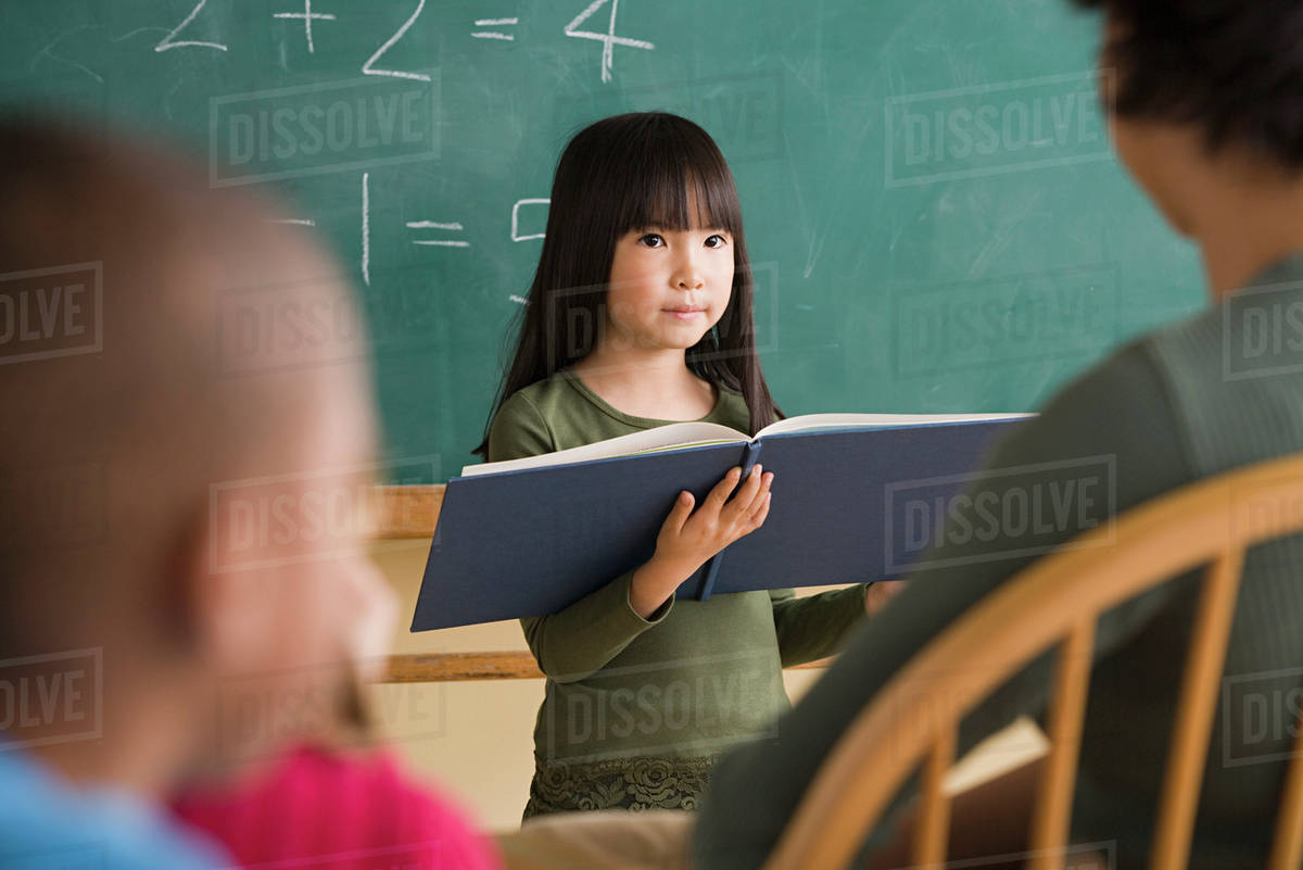 Girl (6-7) having presentation in classroom - Royalty-free Stock Photo ...