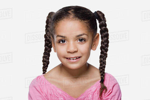 Portrait of smiling girl (8-9) with braids, studio shot - Royalty-free ...