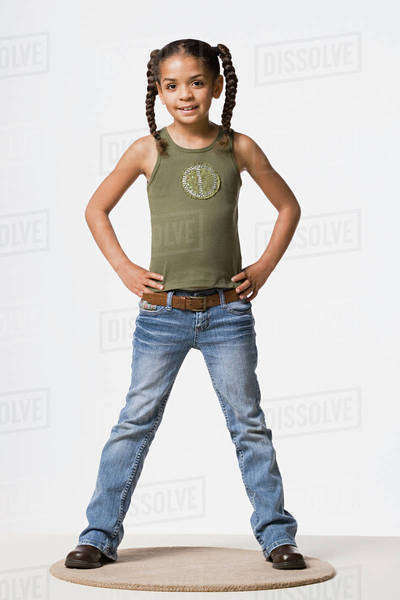 Studio portrait of smiling girl (8-9) with plaits - Royalty-free Stock ...