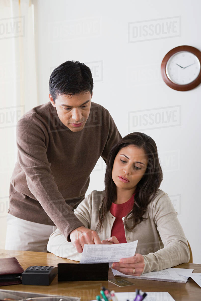 Couple doing paperwork - Royalty-free Stock Photo | Dissolve