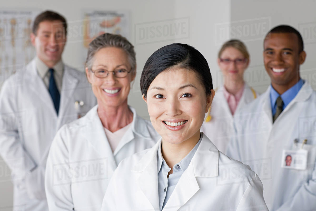 Group portrait of smiling doctors - Royalty-free Stock Photo | Dissolve
