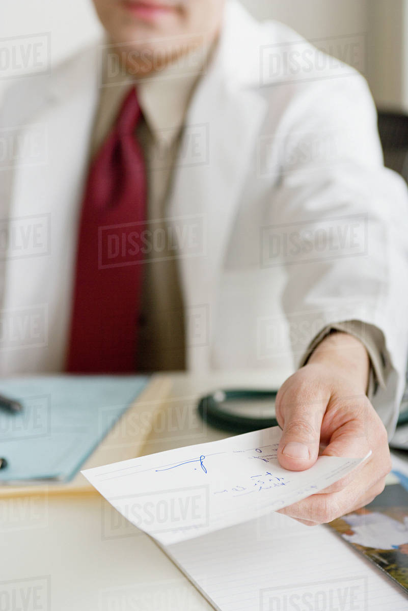 Doctor holding prescription - Royalty-free Stock Photo | Dissolve