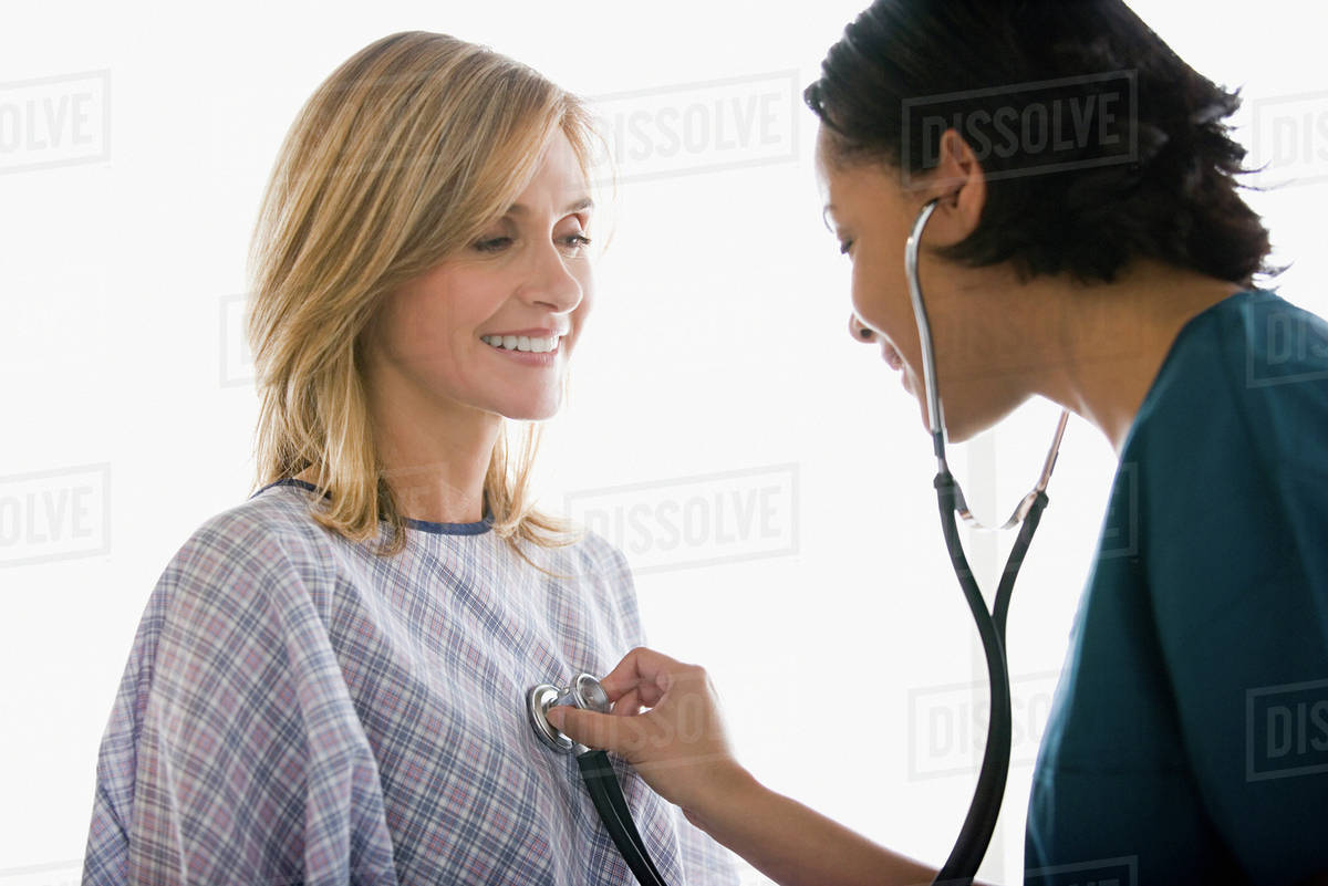 Doctor examining patient - Stock Photo - Dissolve