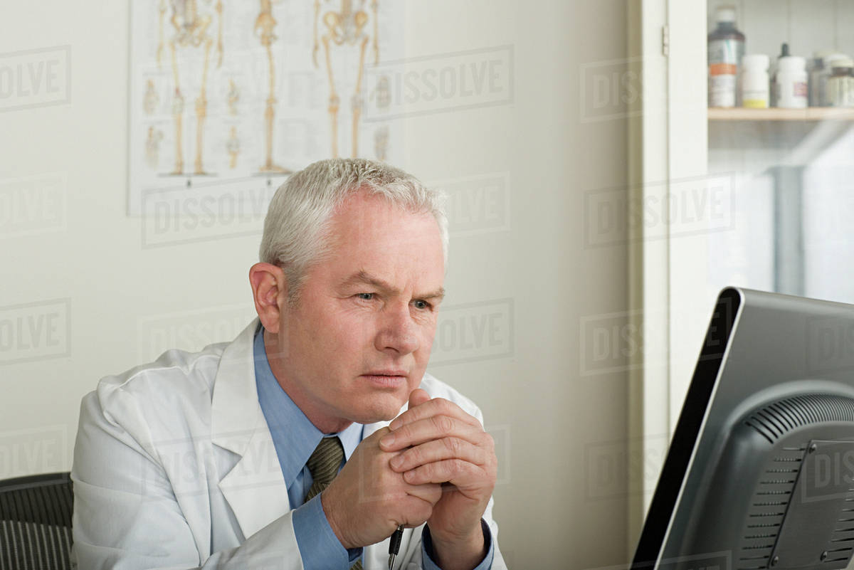 Doctor working on computer - Royalty-free Stock Photo | Dissolve