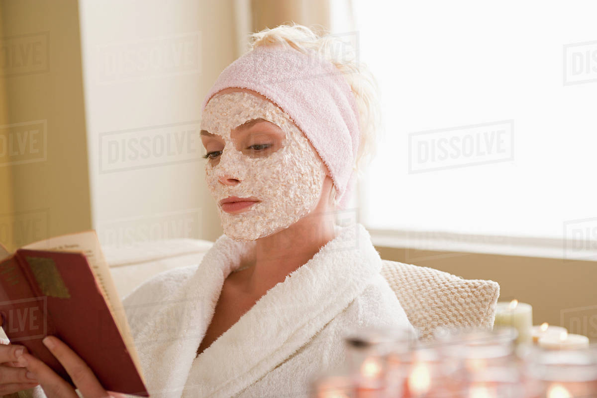 Woman reading book in spa - Royalty-free Stock Photo | Dissolve