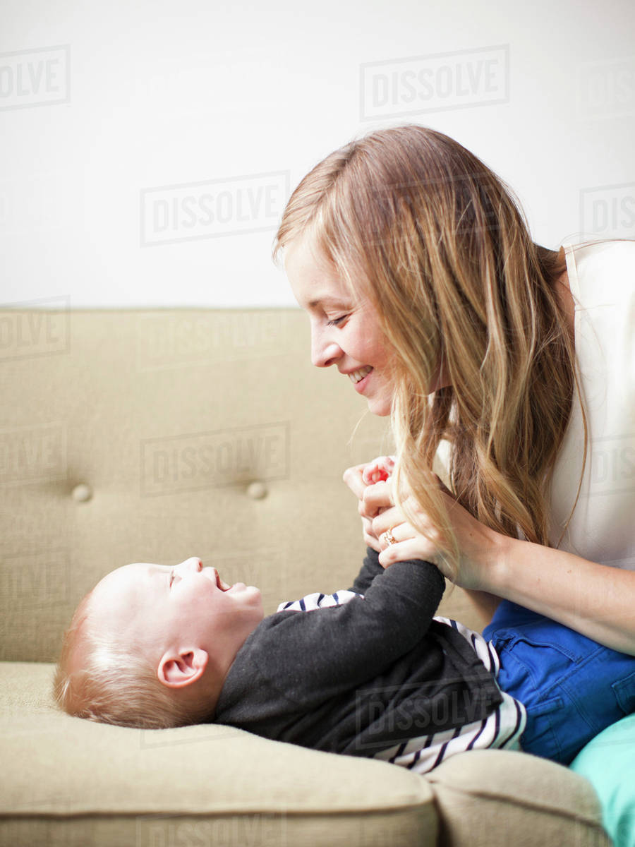 Mother embracing baby boy (12-17 months) - Royalty-free Stock Photo ...
