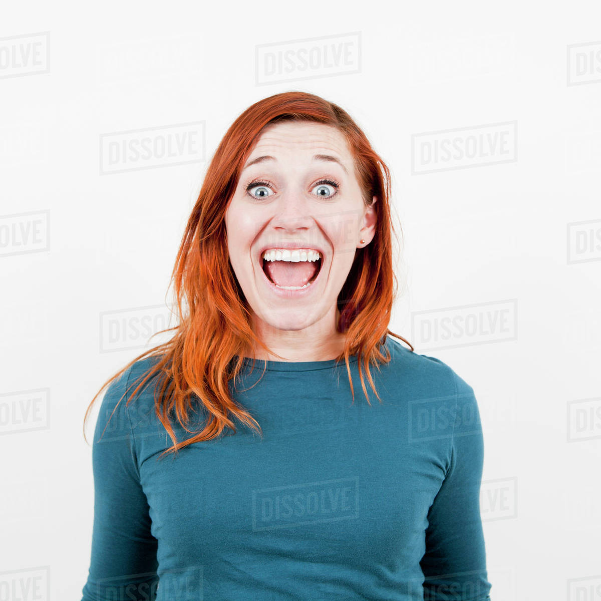 Studio Shot, Portrait of woman laughing - Stock Photo - Dissolve