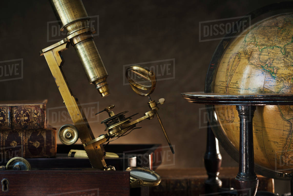 Old microscope and globe - Royalty-free Stock Photo | Dissolve