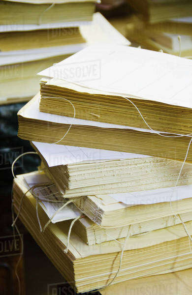 Close up of books without covers being prepared for binding - Royalty ...