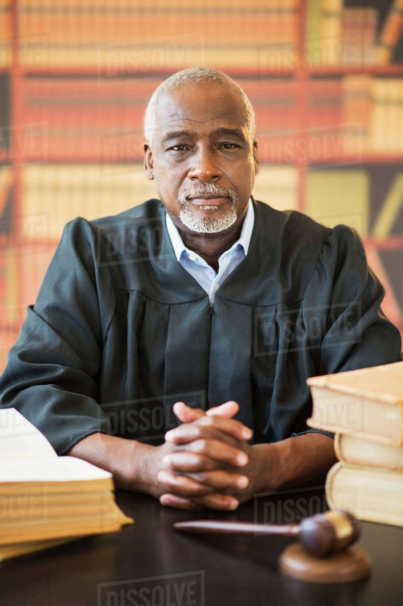 Portrait of judge in courtroom, gavel in front - Royalty-free Stock ...