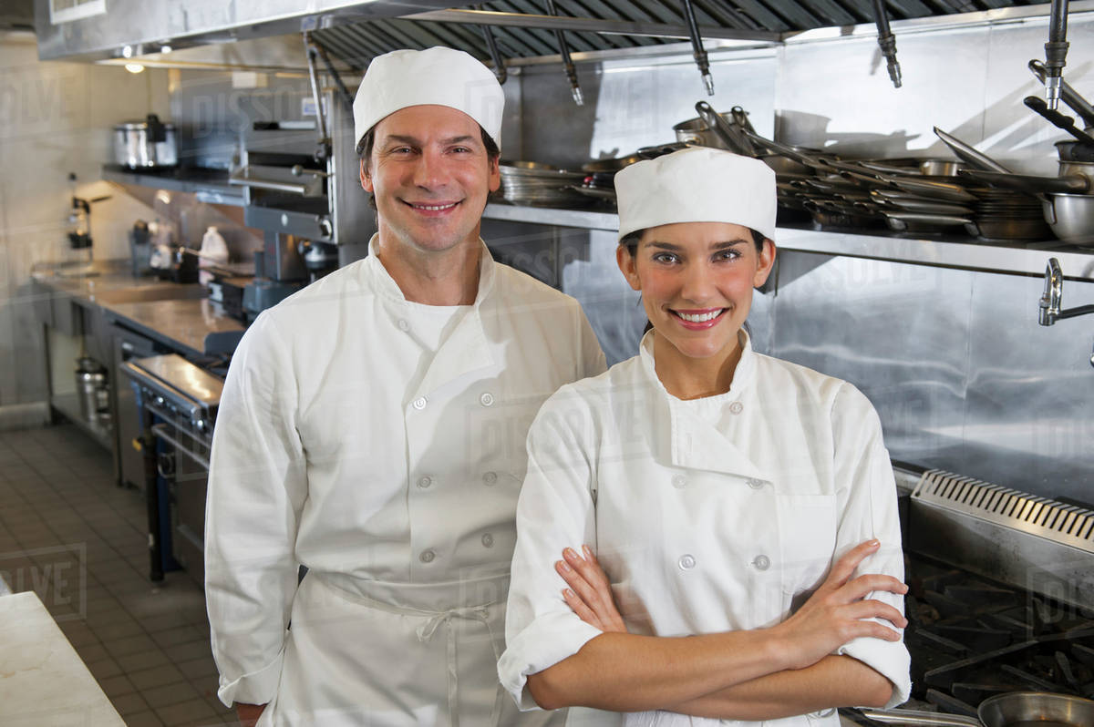 Chef and cook in commercial kitchen - Royalty-free Stock Photo | Dissolve