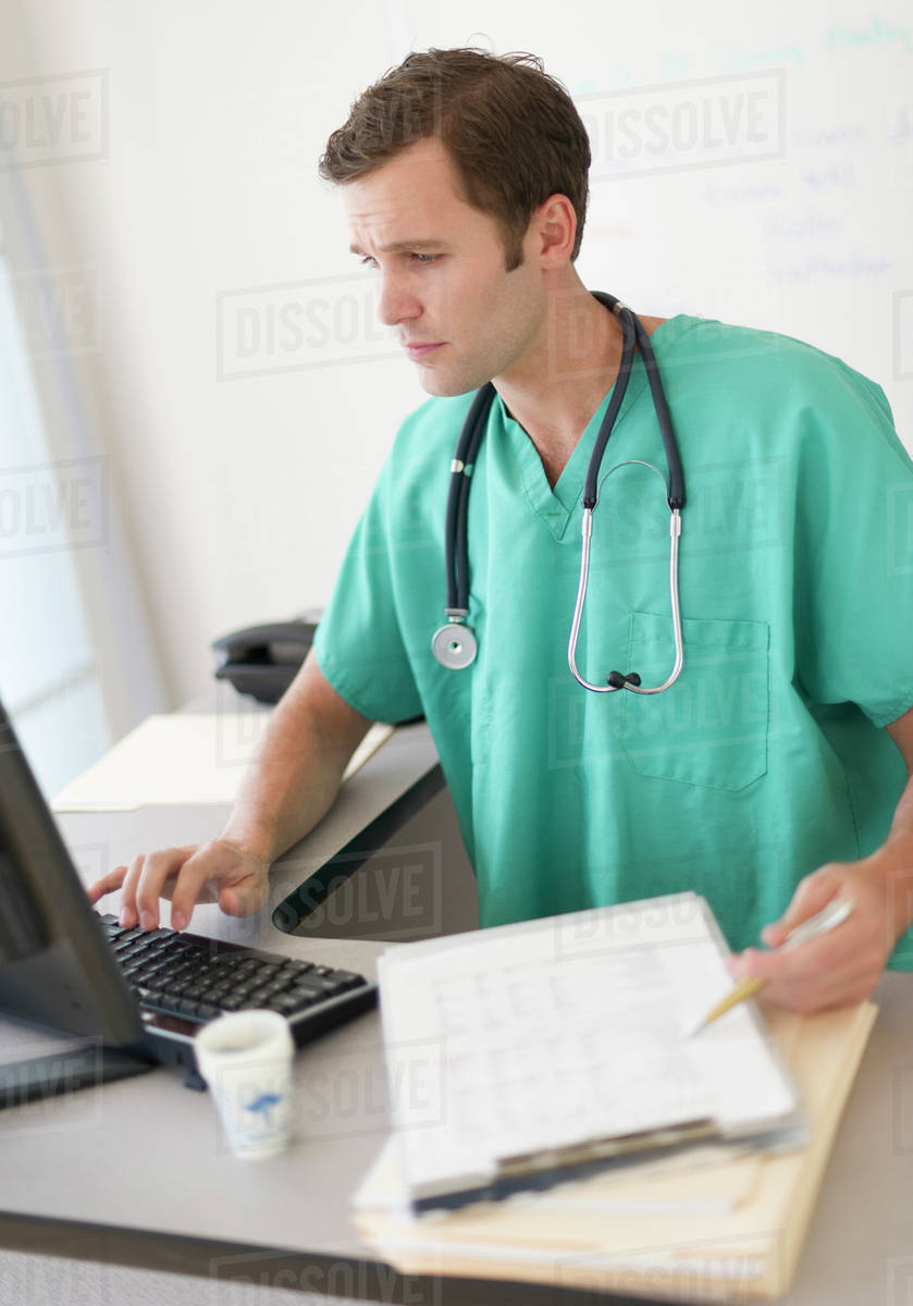 Doctor using computer - Royalty-free Stock Photo | Dissolve