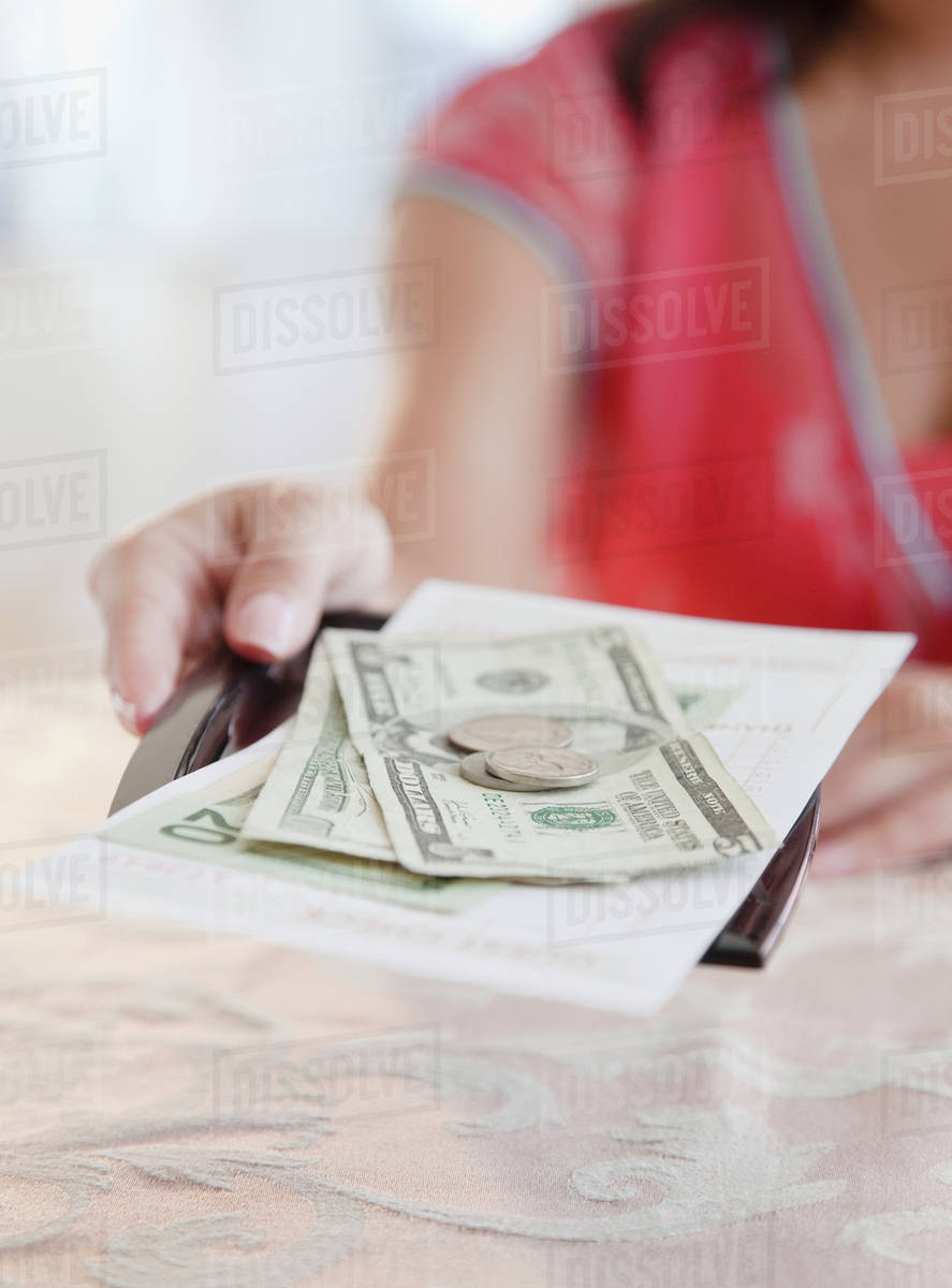 Woman taking money - Royalty-free Stock Photo | Dissolve