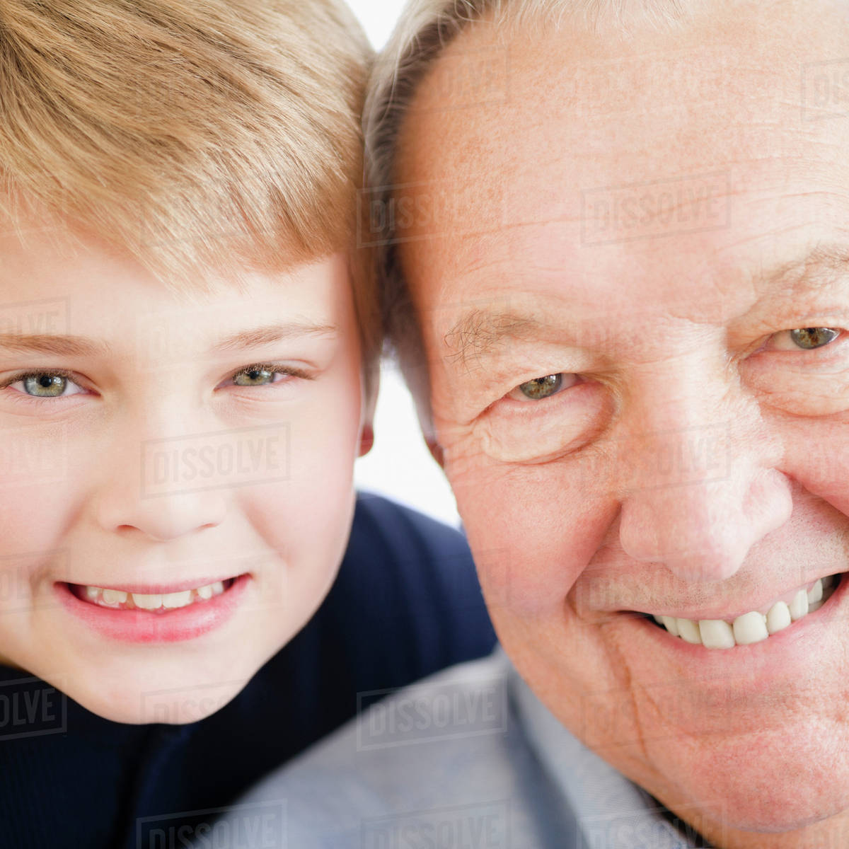 Close up of smiling faces of grandfather and grandson (8-9) - Royalty ...