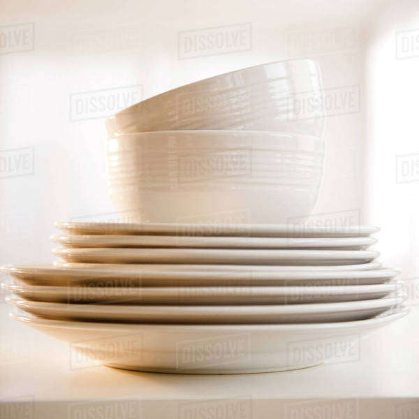 Close up of stack of dinnerware - Royalty-free Stock Photo | Dissolve