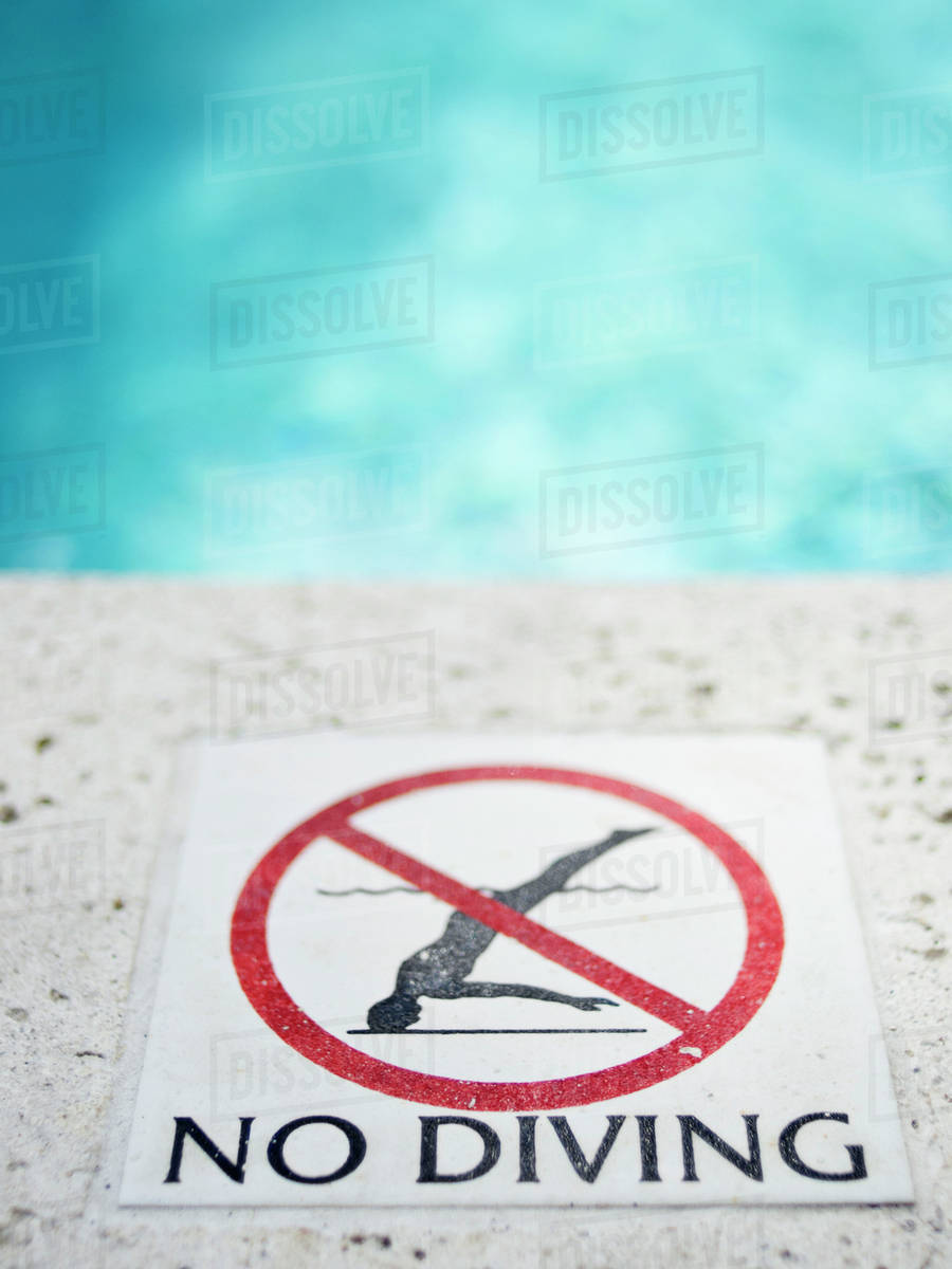 Close up of warning sign "no diving" - Royalty-free Stock Photo | Dissolve