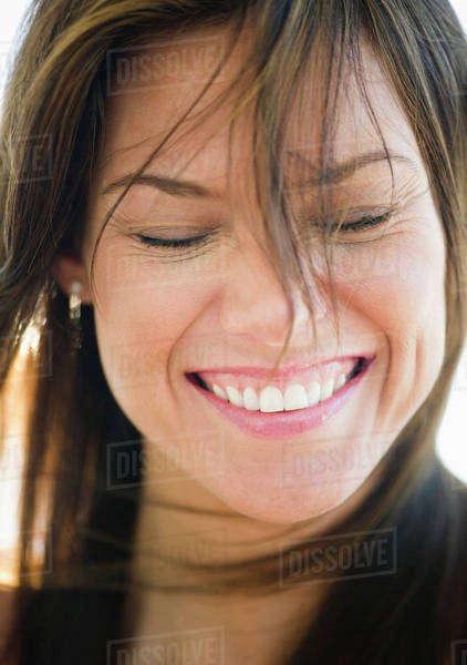 Portrait of smiling woman with eyes closed - Royalty-free Stock Photo ...
