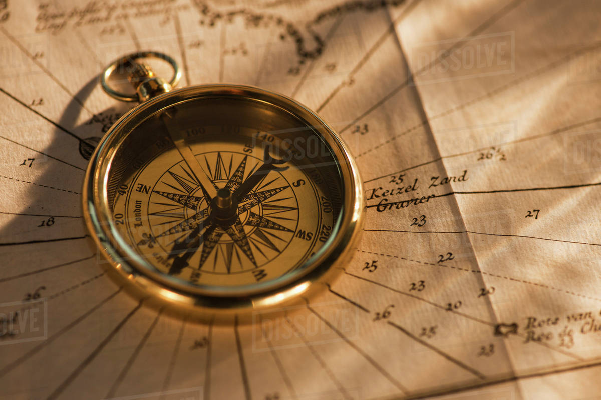 Compass on map - Stock Photo - Dissolve