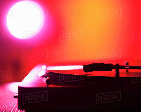 Close up of turntable on colored background - Stock Photo - Dissolve
