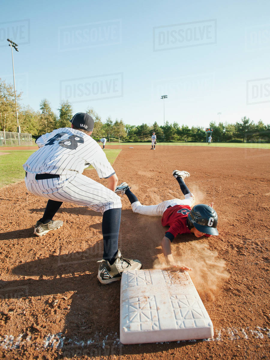 Boys (10-11) playing baseball - Royalty-free Stock Photo | Dissolve