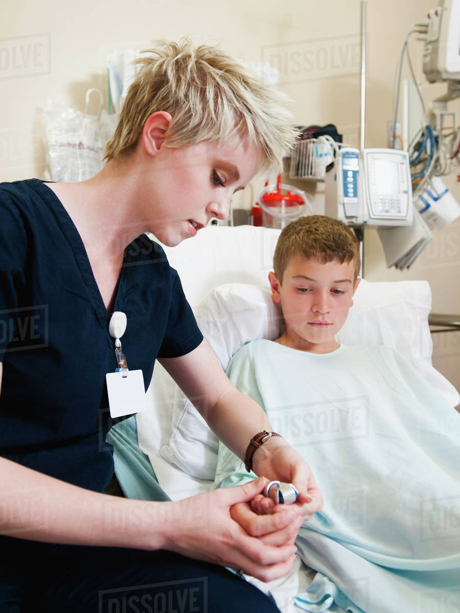 Nurse and boy (10-11) - Royalty-free Stock Photo | Dissolve