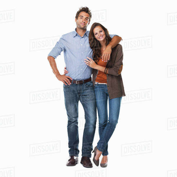 Studio shot of young couple standing together on white background ...