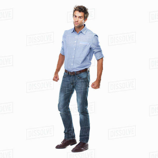 Studio shot of young man ready to fight standing on white background ...