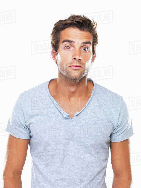 Studio portrait of man with eyes wide open - Royalty-free Stock Photo ...