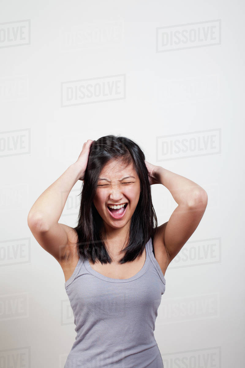 Enthusiastic young woman - Royalty-free Stock Photo | Dissolve