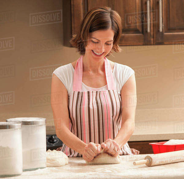 Woman preparing dough - Royalty-free Stock Photo | Dissolve
