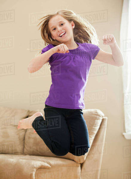 USA, Utah, Lehi, Portrait of girl (8-9) jumping - Royalty-free Stock ...