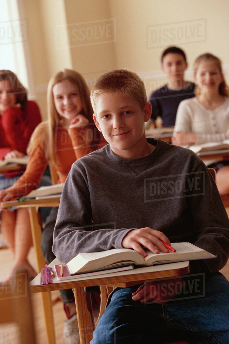 Students sitting at desks - Royalty-free Stock Photo | Dissolve