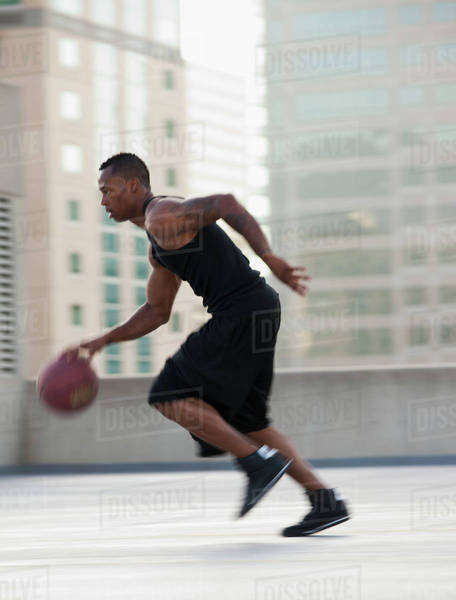 USA, Utah, Salt Lake City, Young man playing basketball - Royalty-free ...